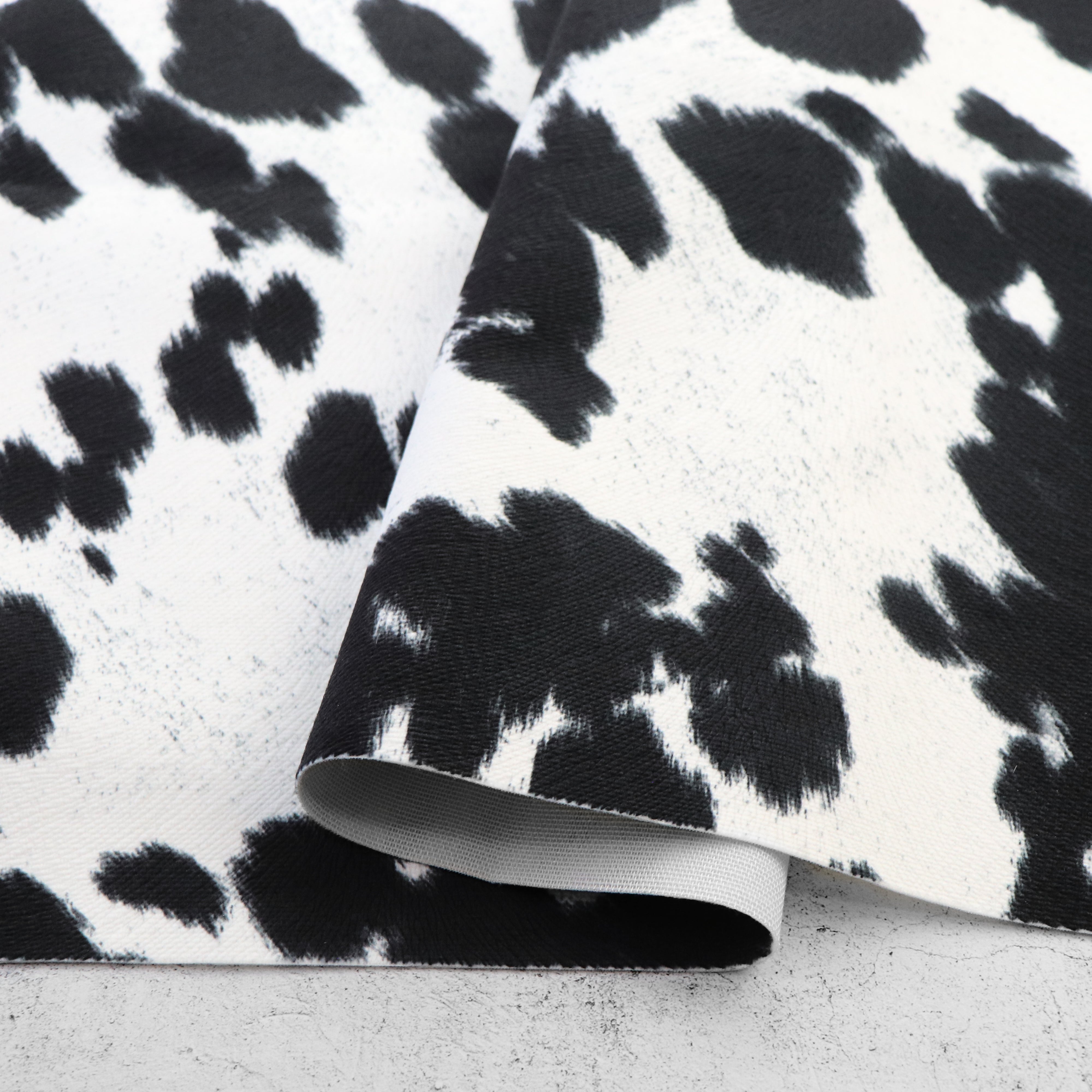 Cow Cream Black Faux Fur – Sallie Tomato